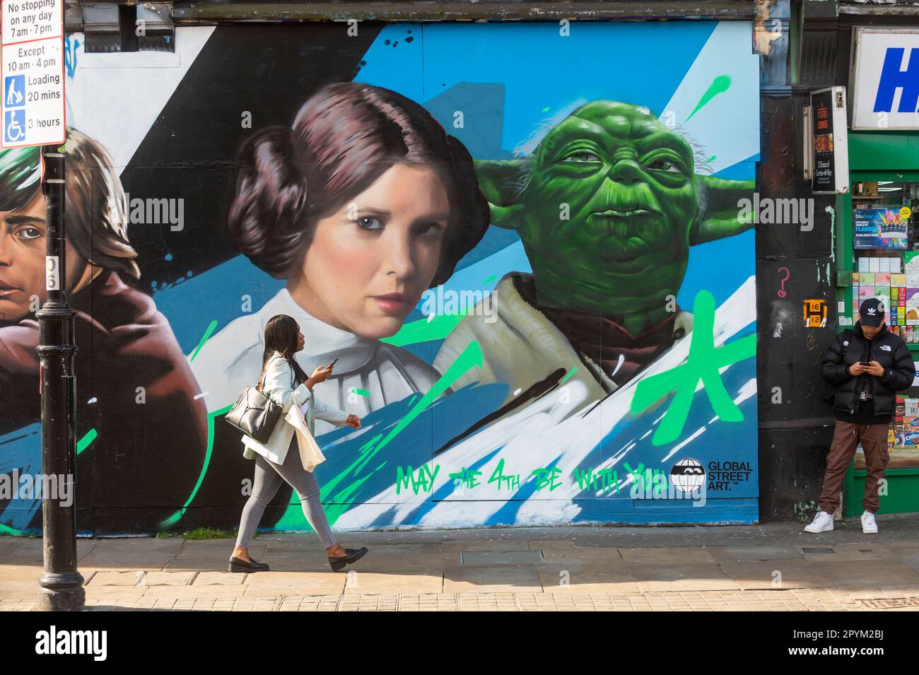London, UK. 4 May 2023. People in Shoreditch pass a newly unveiled Star ...