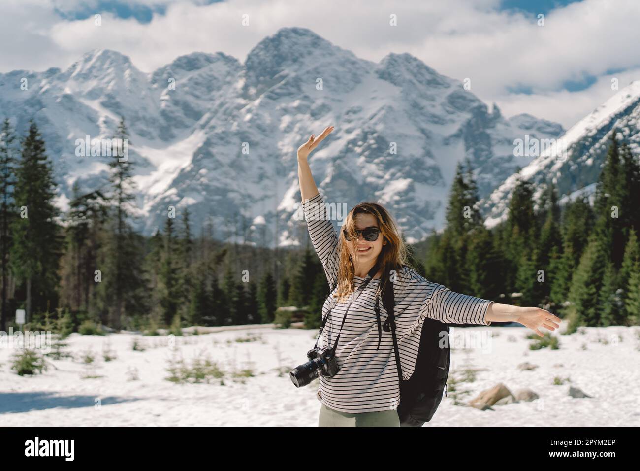 Back view of a girl traveler wearing a backpack traveling alone Stock ...