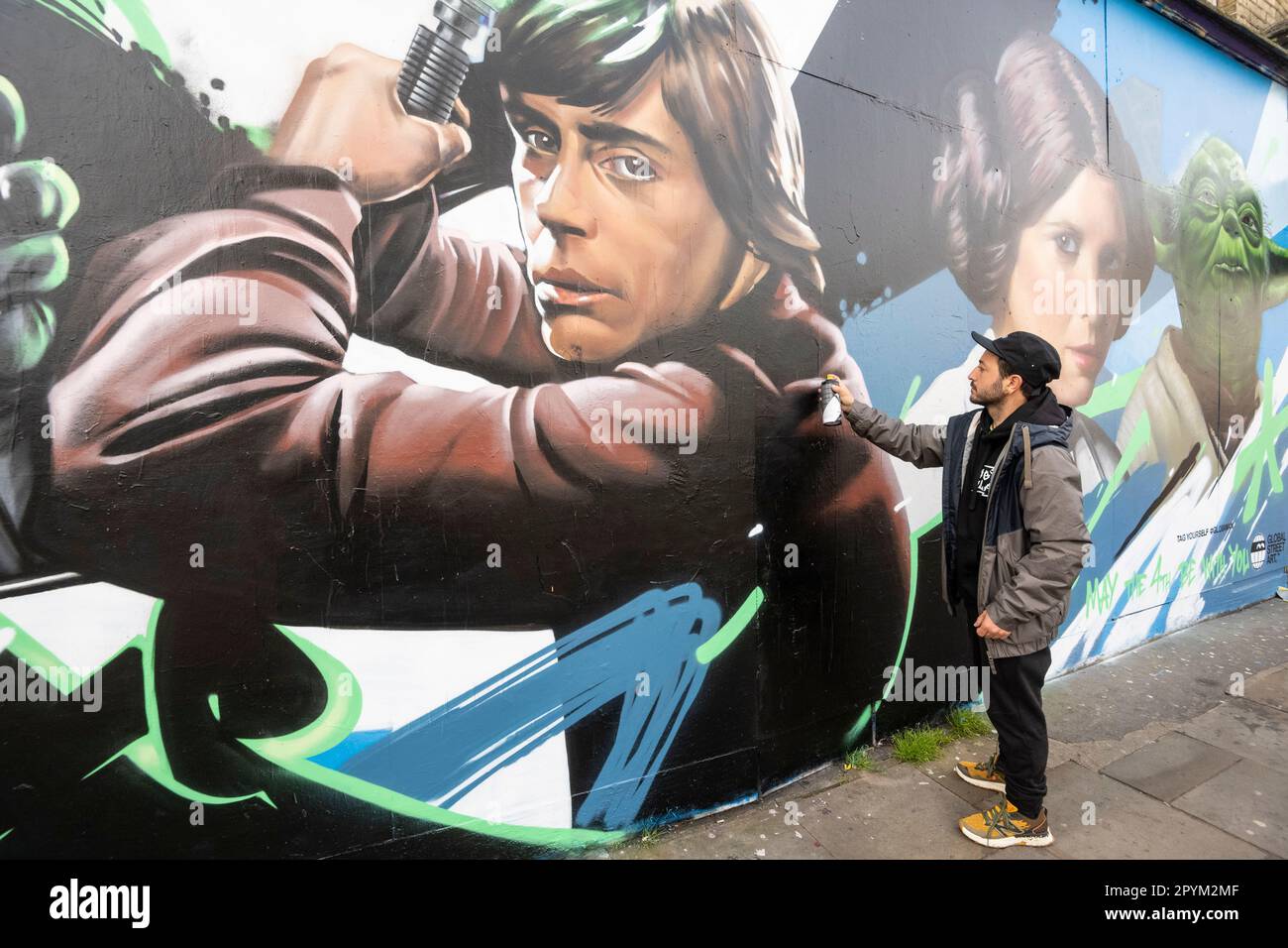 London, UK. 4 May 2023. Street artist Nacho Welles puts the finishing ...