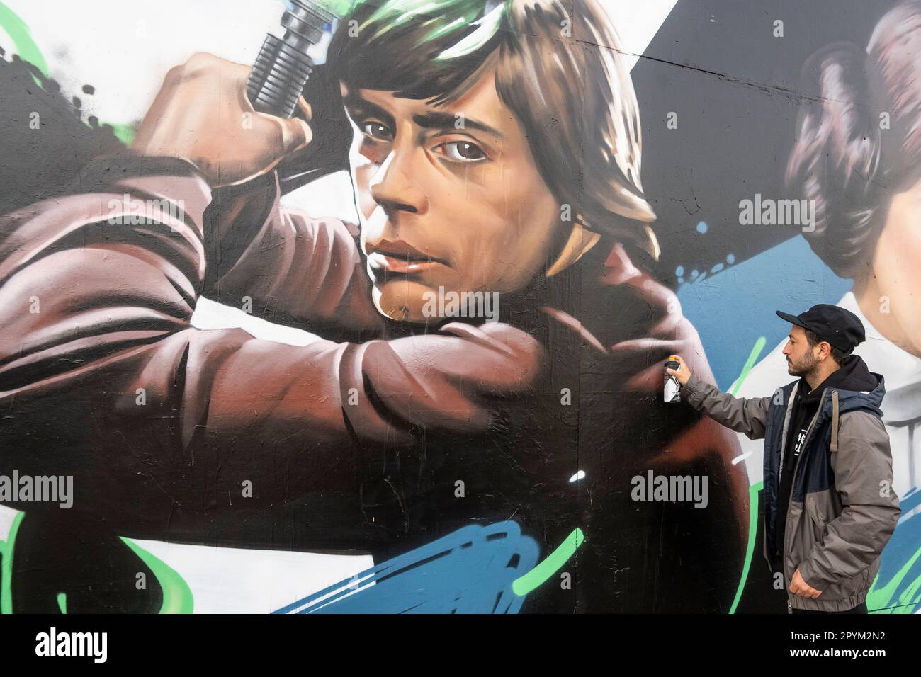 London, UK. 4 May 2023. Street artist Nacho Welles puts the finishing ...