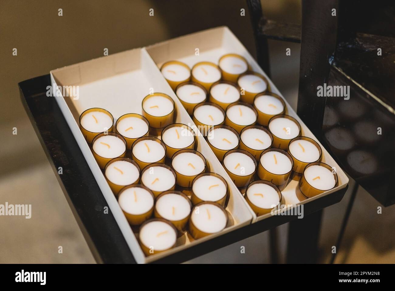 Many Candles in a cathedral. Religious ritual in the church Stock Photo ...