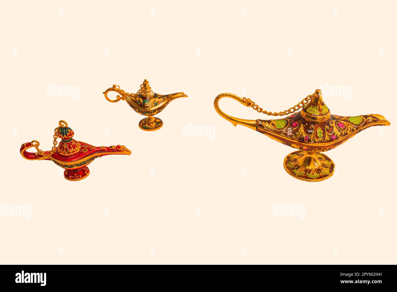 Three old golden magic lamps isolated on bright background Stock Photo ...