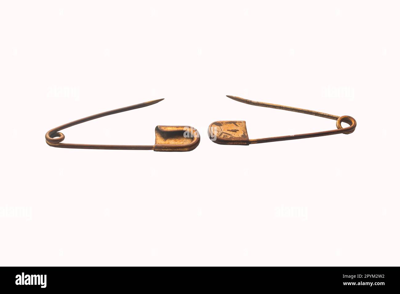 An old and rusty safety pin set isolated on white background Stock ...