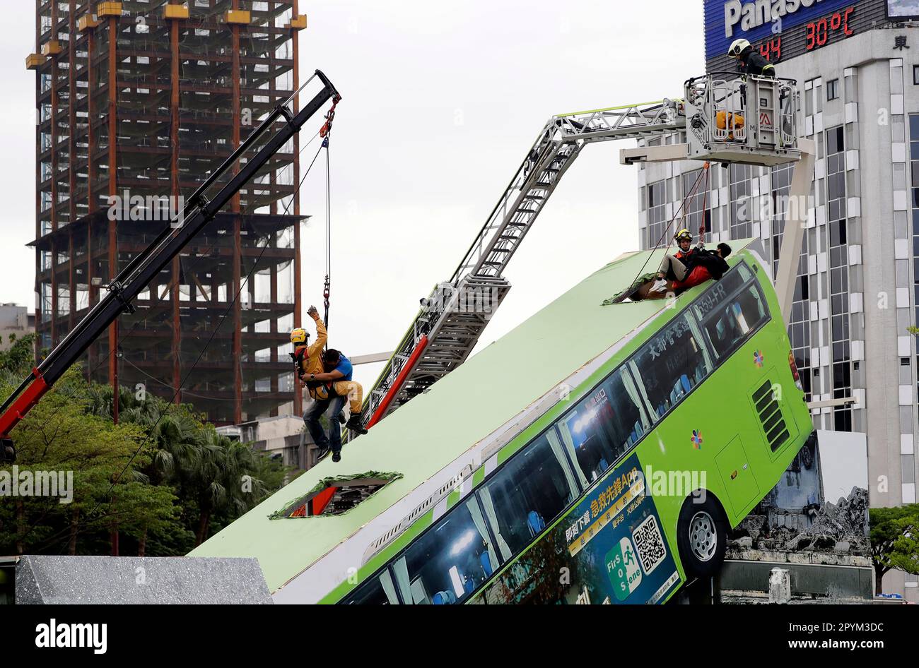 People practice rescue operation in a traffic accident scene during a ...