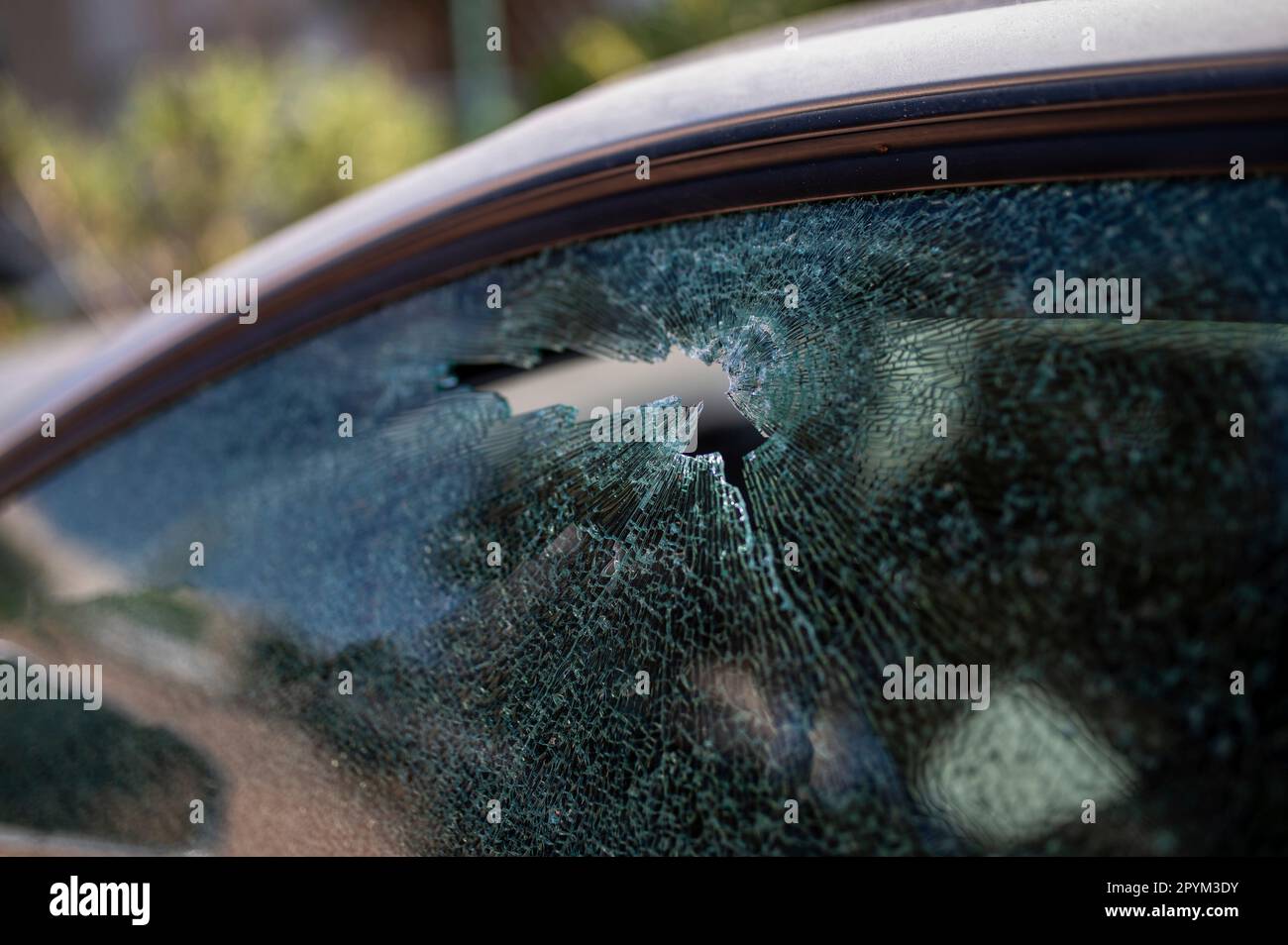 Broken car window after a gunshot, in Plaça de les Palmeres, on May 4 ...