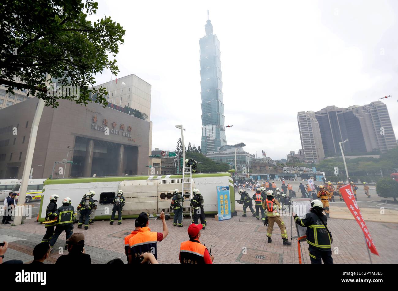 People practice a rescue operation in a traffic accident scene during a ...