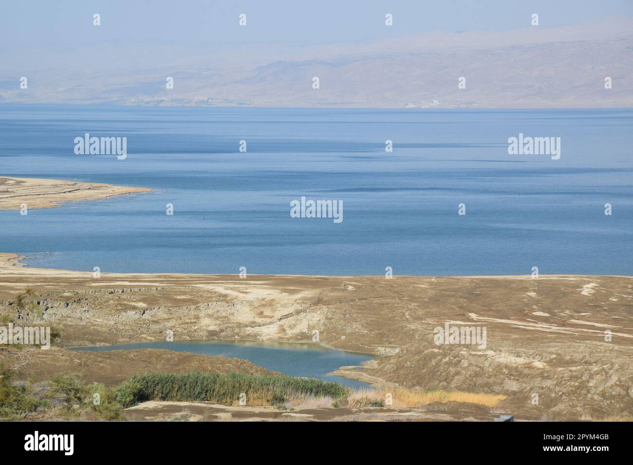 Receding sea level and dried out coastline of the Dead Sea: Driving ...