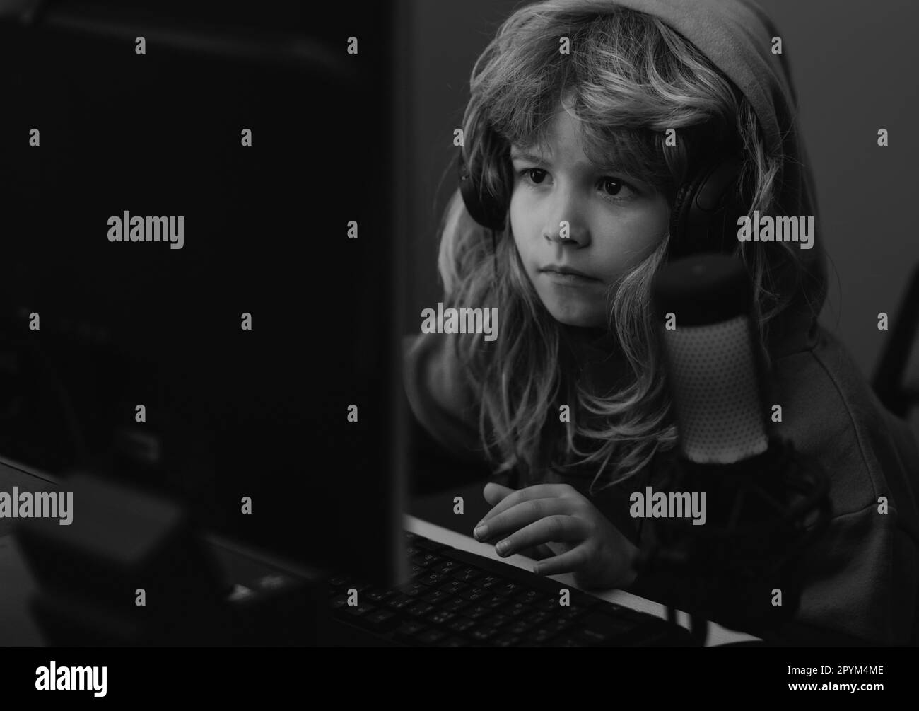 Cute preschool child watching video lesson by laptop. Little child ...