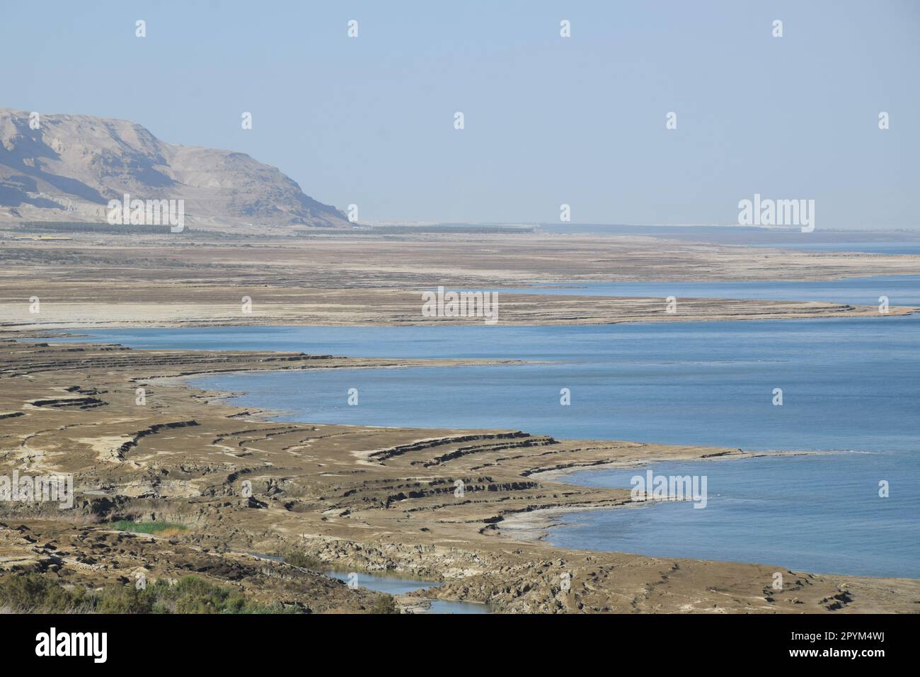 Receding sea level and dried out coastline of the Dead Sea: Driving ...