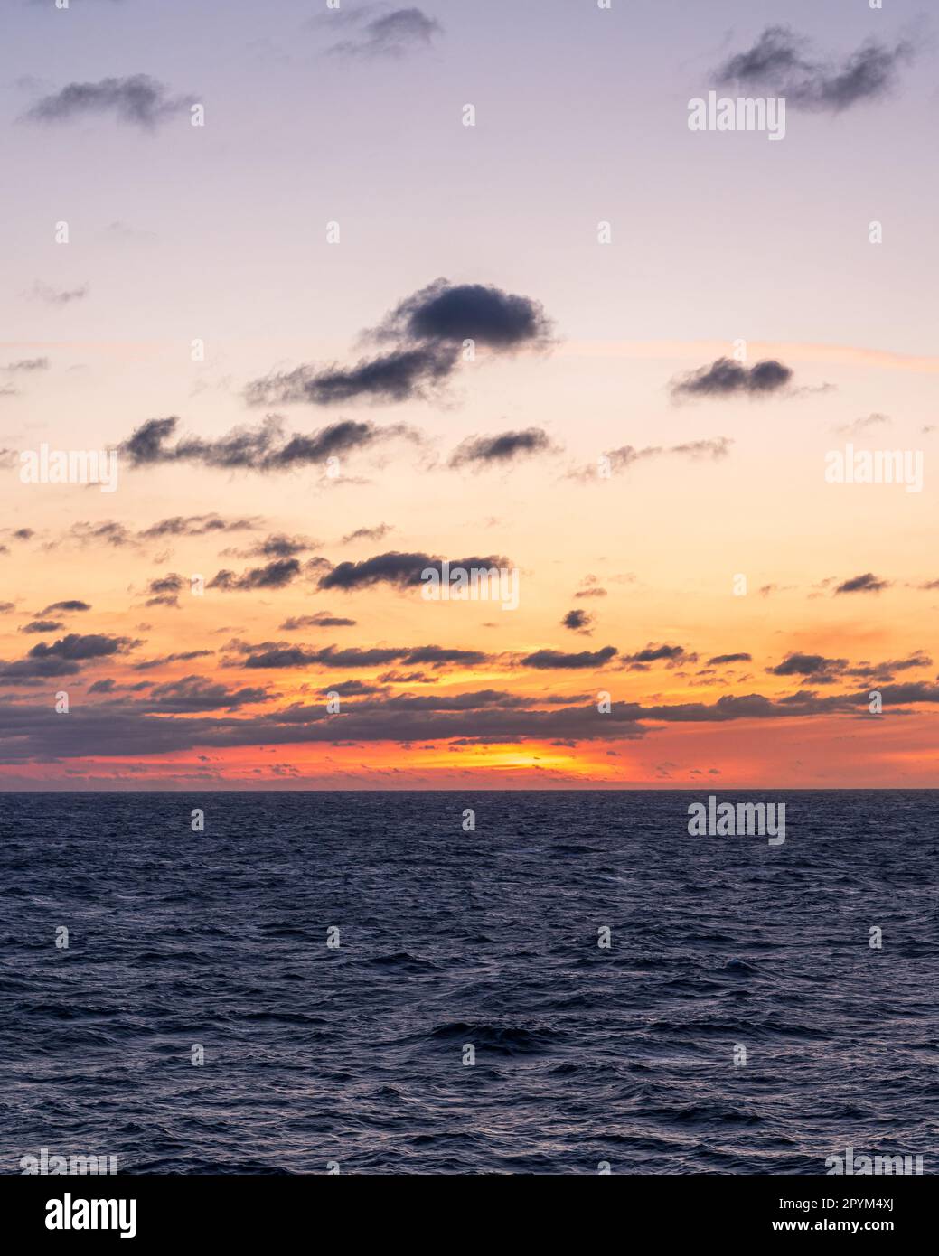 A high resolution vertical shot of a serene ocean with no visible ...