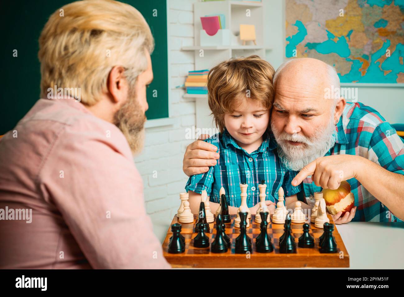 Portrait grandpa and grandson playing and learning. Family relationship ...