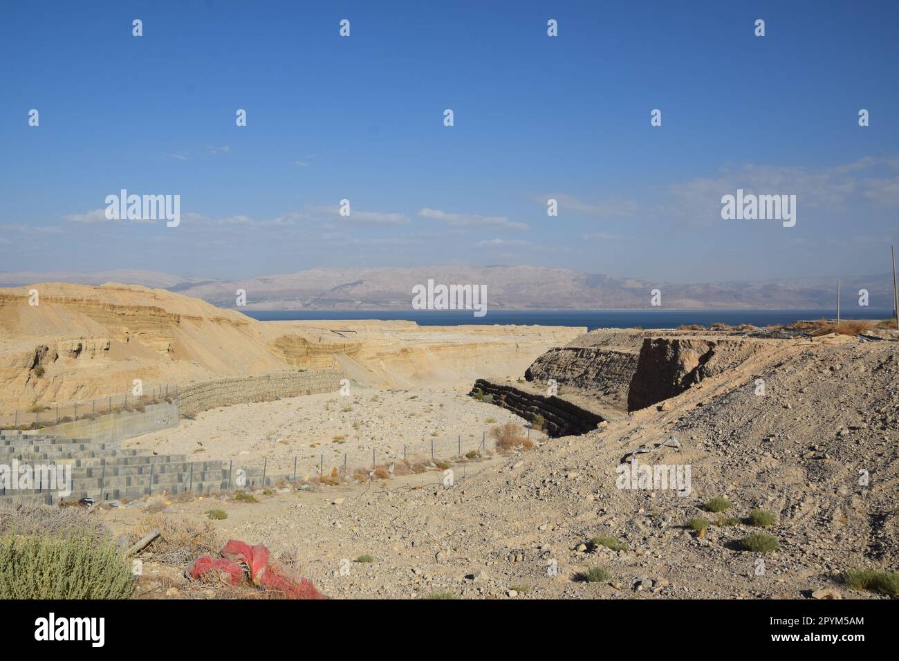 Empty riverbed - Receding sea level and dried out coastline of the Dead ...