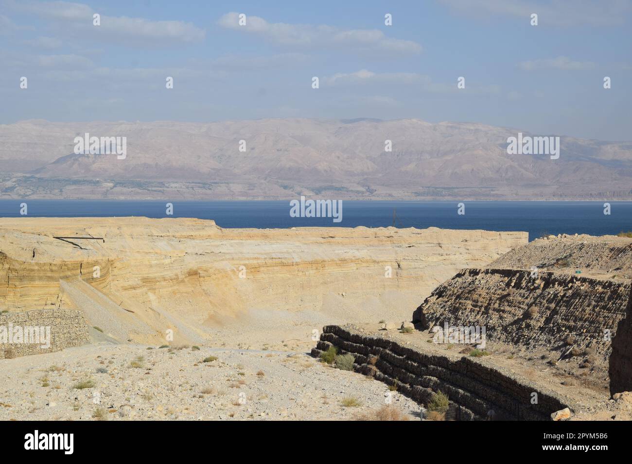 Empty riverbed - Receding sea level and dried out coastline of the Dead ...