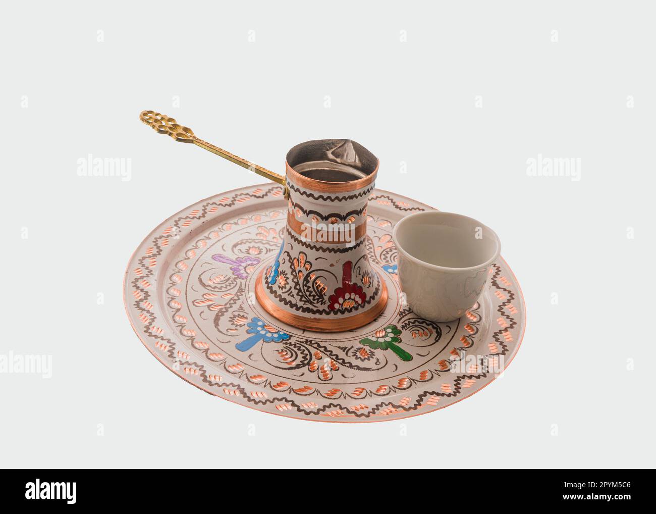An Arabic handmade decorative coffee set isolated on a white background ...