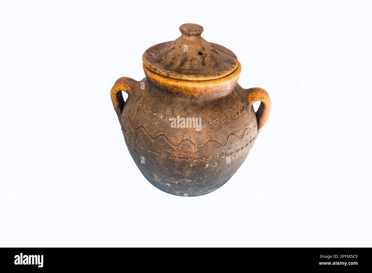 An old earthen cooking pot isolated on white background Stock Photo - Alamy