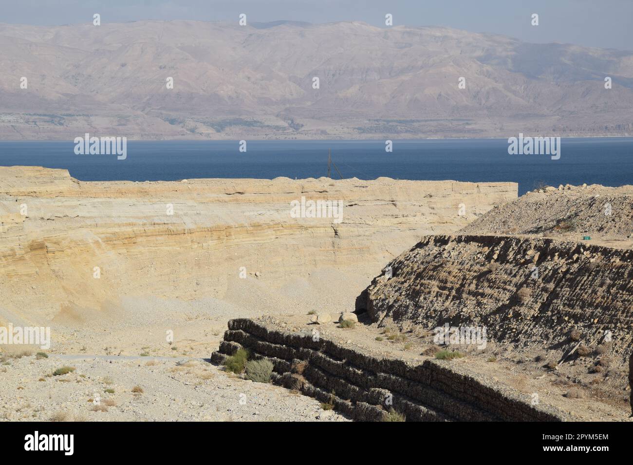 Empty riverbed - Receding sea level and dried out coastline of the Dead ...