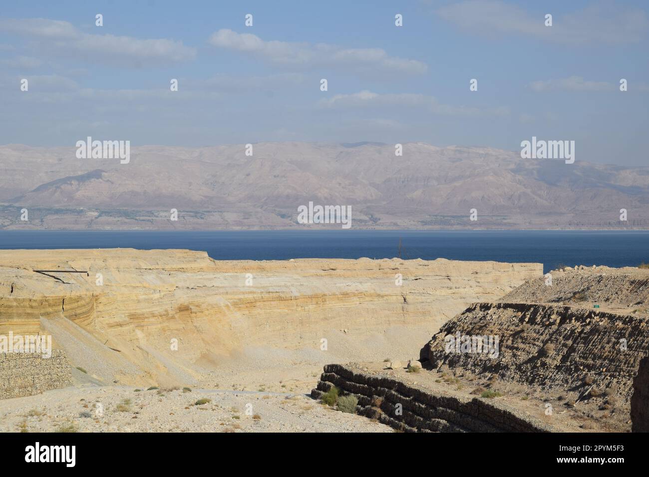 Empty riverbed - Receding sea level and dried out coastline of the Dead ...