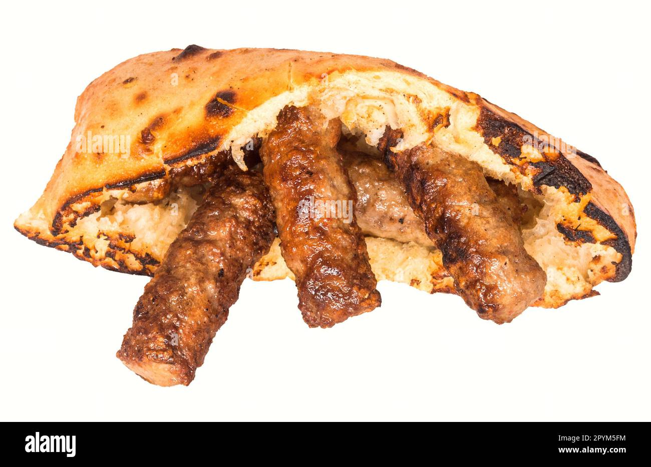 A Cevapi, traditional Balkan food in bread, isolated on white ...