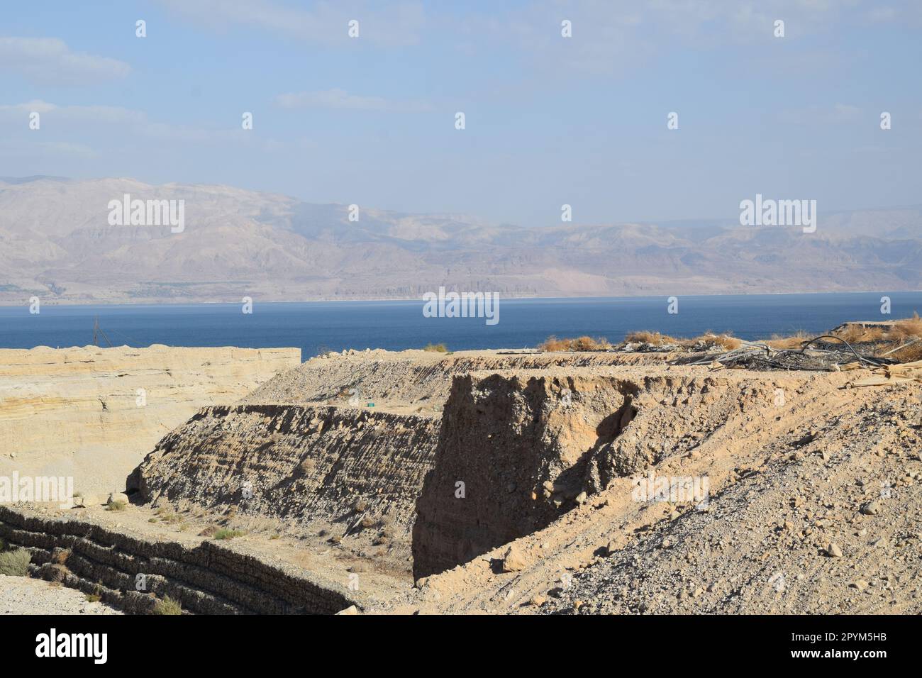 Empty riverbed - Receding sea level and dried out coastline of the Dead ...