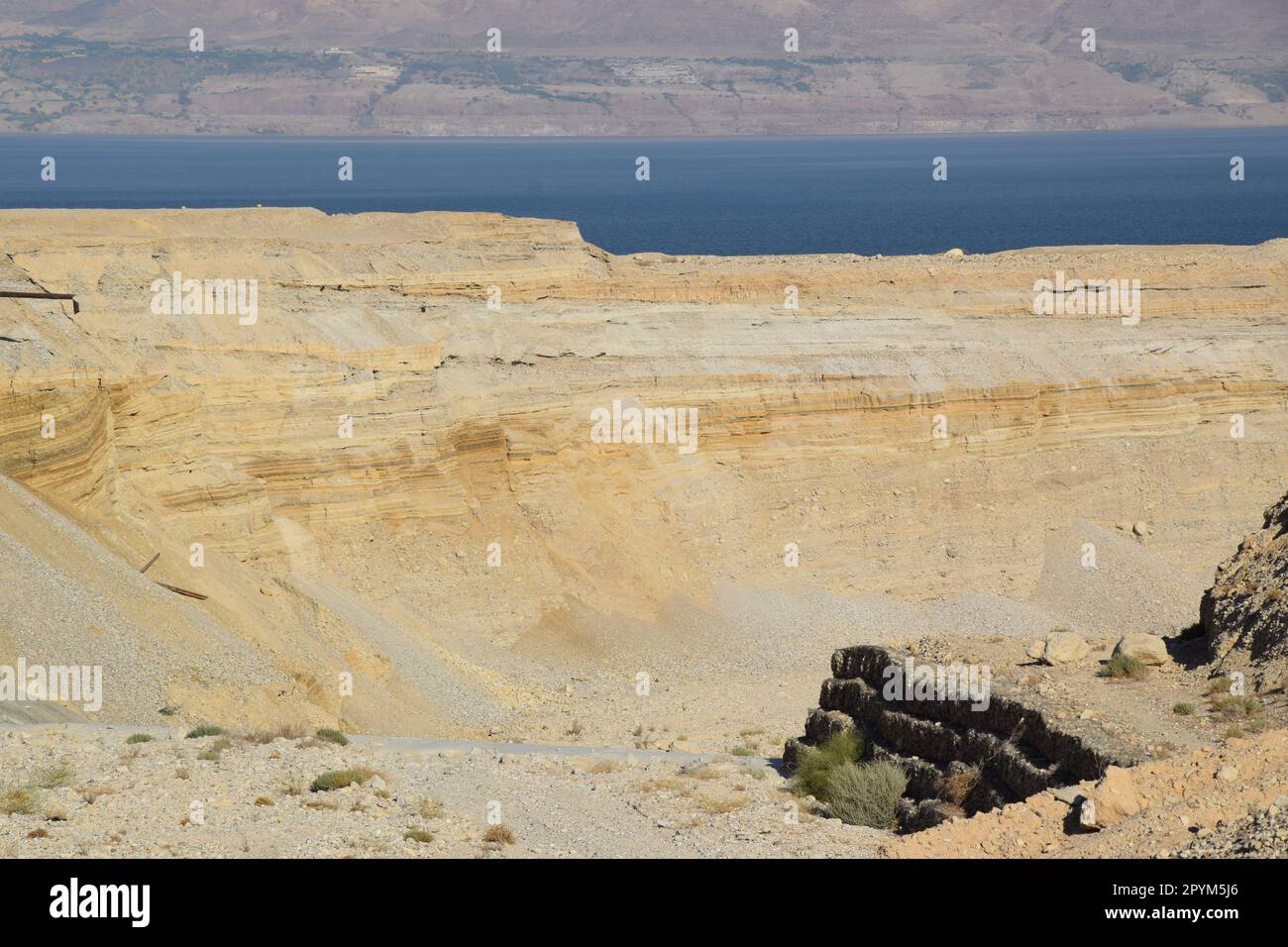 Empty riverbed - Receding sea level and dried out coastline of the Dead ...