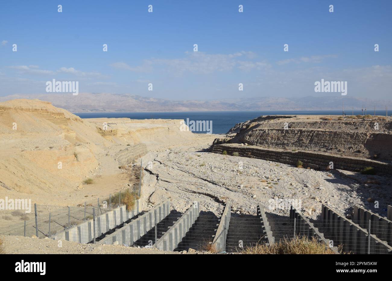 Empty riverbed - Receding sea level and dried out coastline of the Dead ...