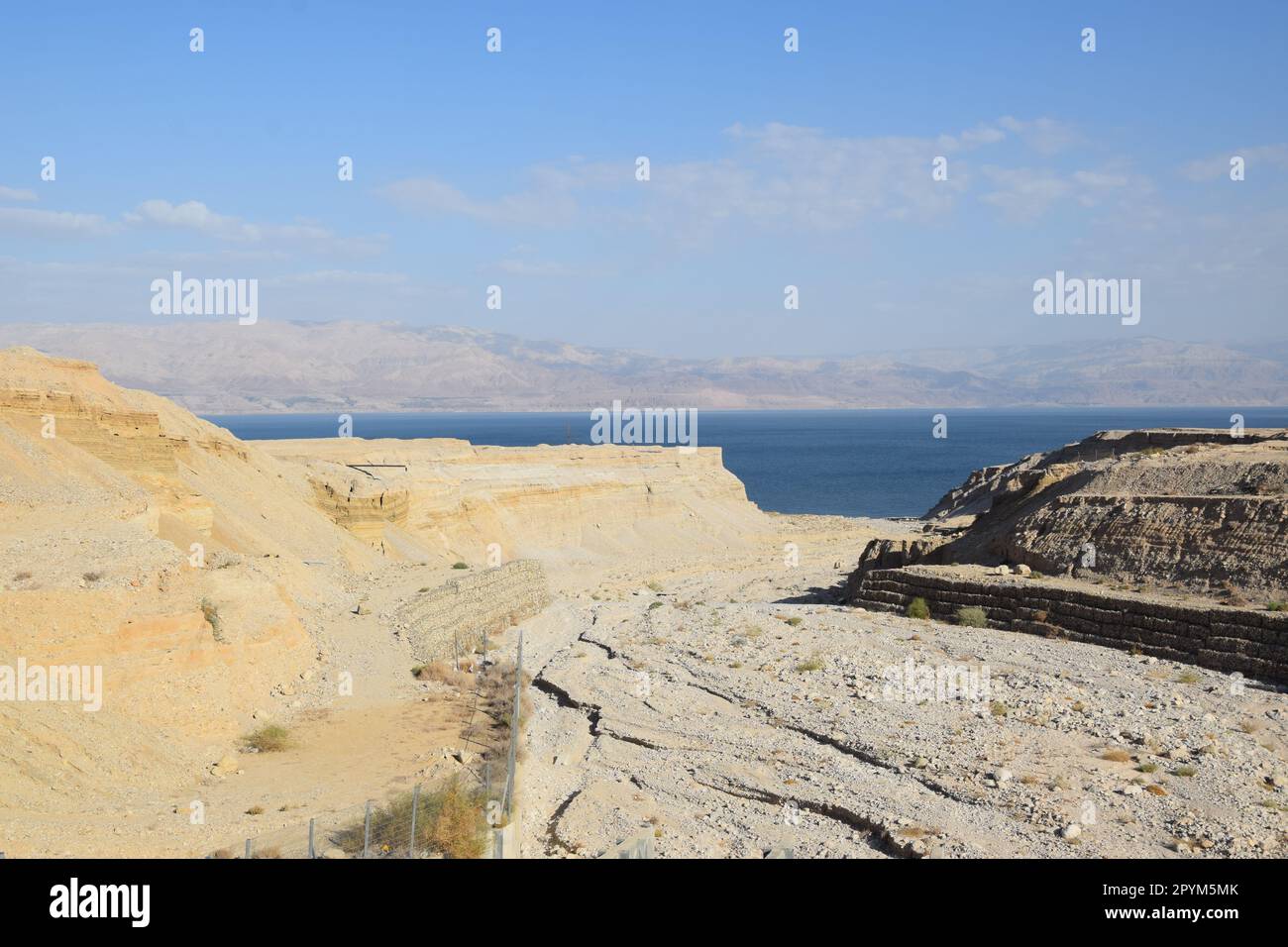 Empty riverbed - Receding sea level and dried out coastline of the Dead ...