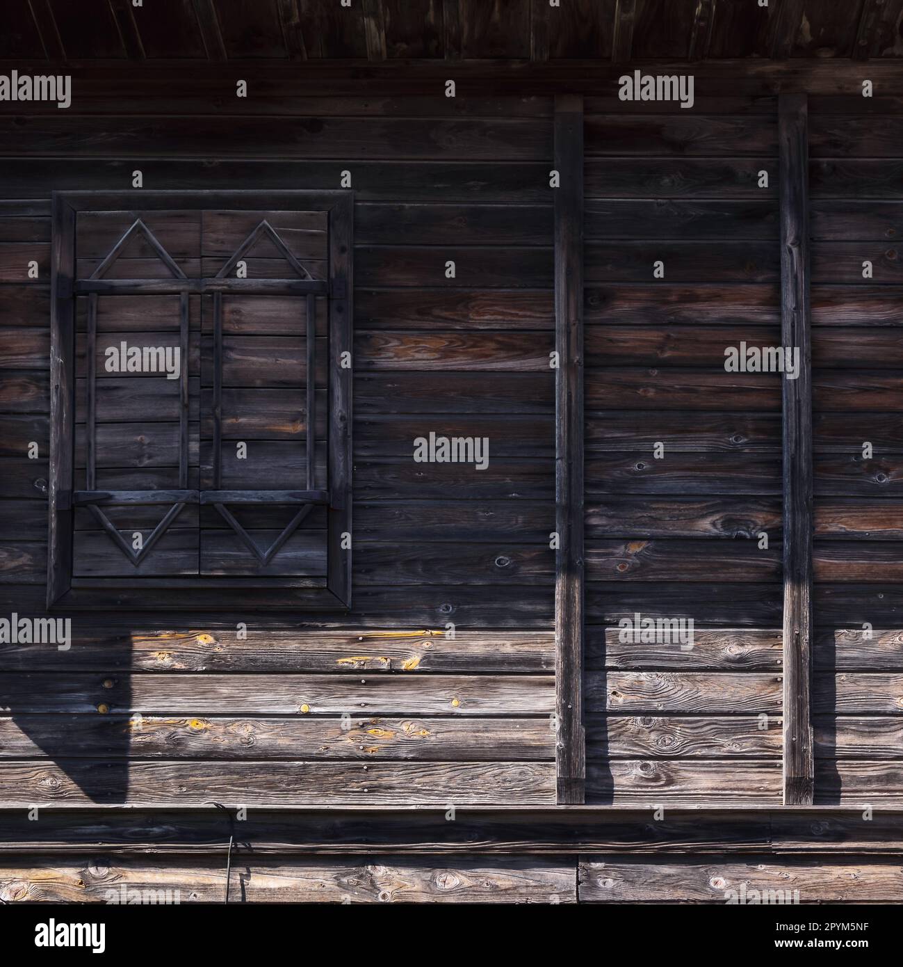 windows on the wooden facade in bulgaria. architectural retro elemet ...