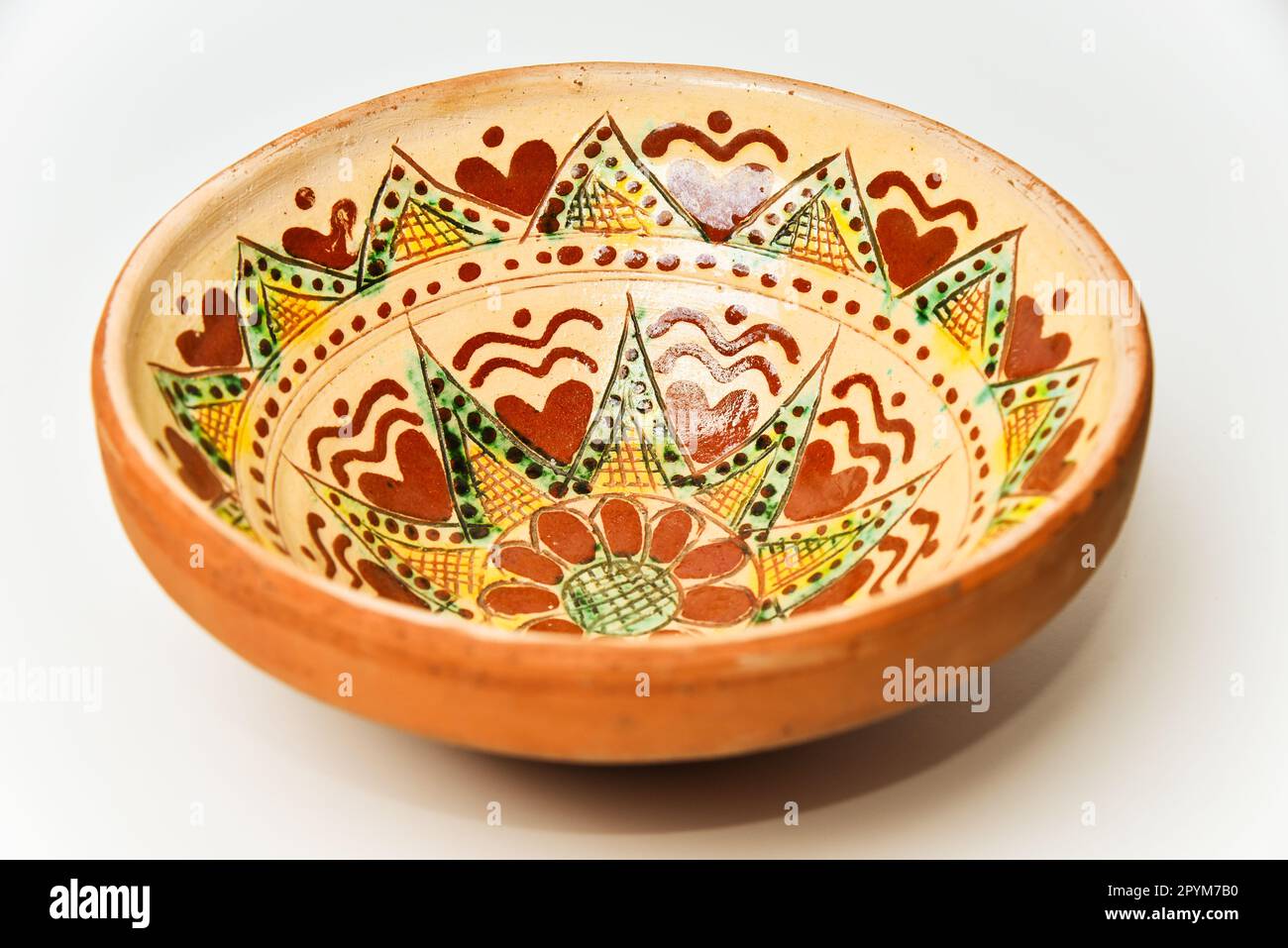 Painted ceramic bowl on a white background. Traditional Ukrainian ...