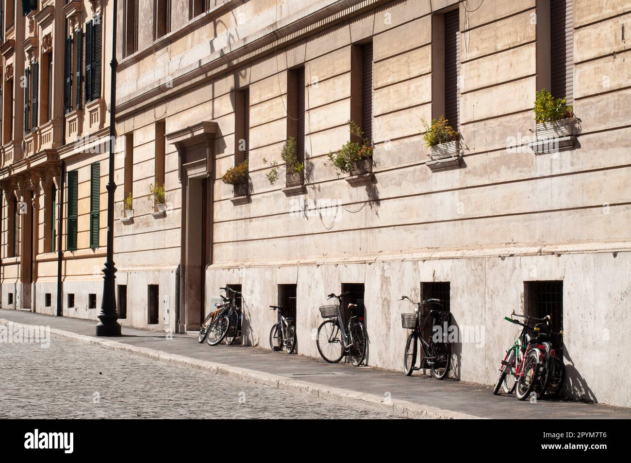 The bicycles organized in a row in front of an urban building in ...