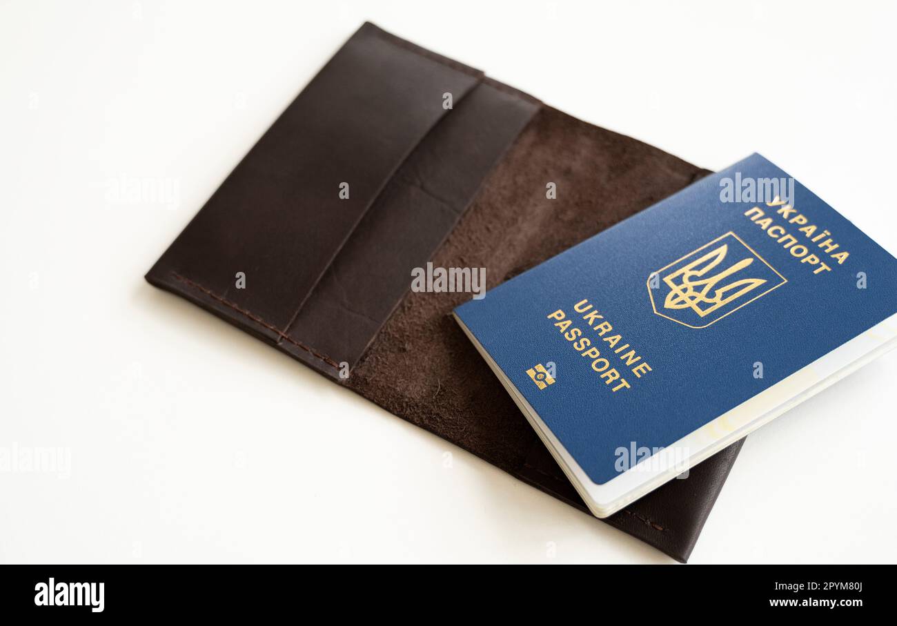 Ukrainian passport with a leather cover on a white background ...