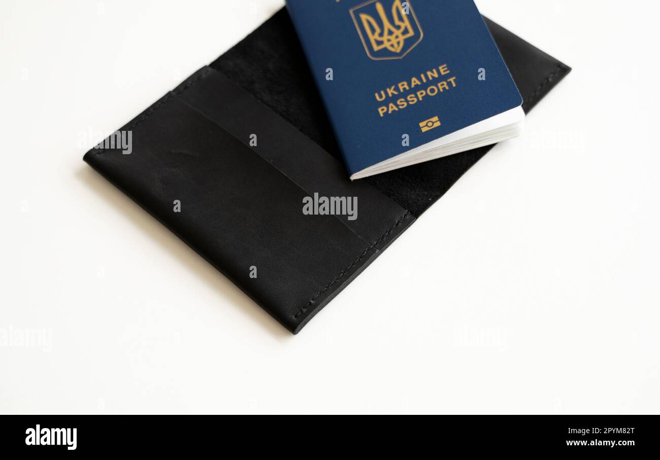 Ukrainian biometric passport id with a genuine leather cover on a white ...