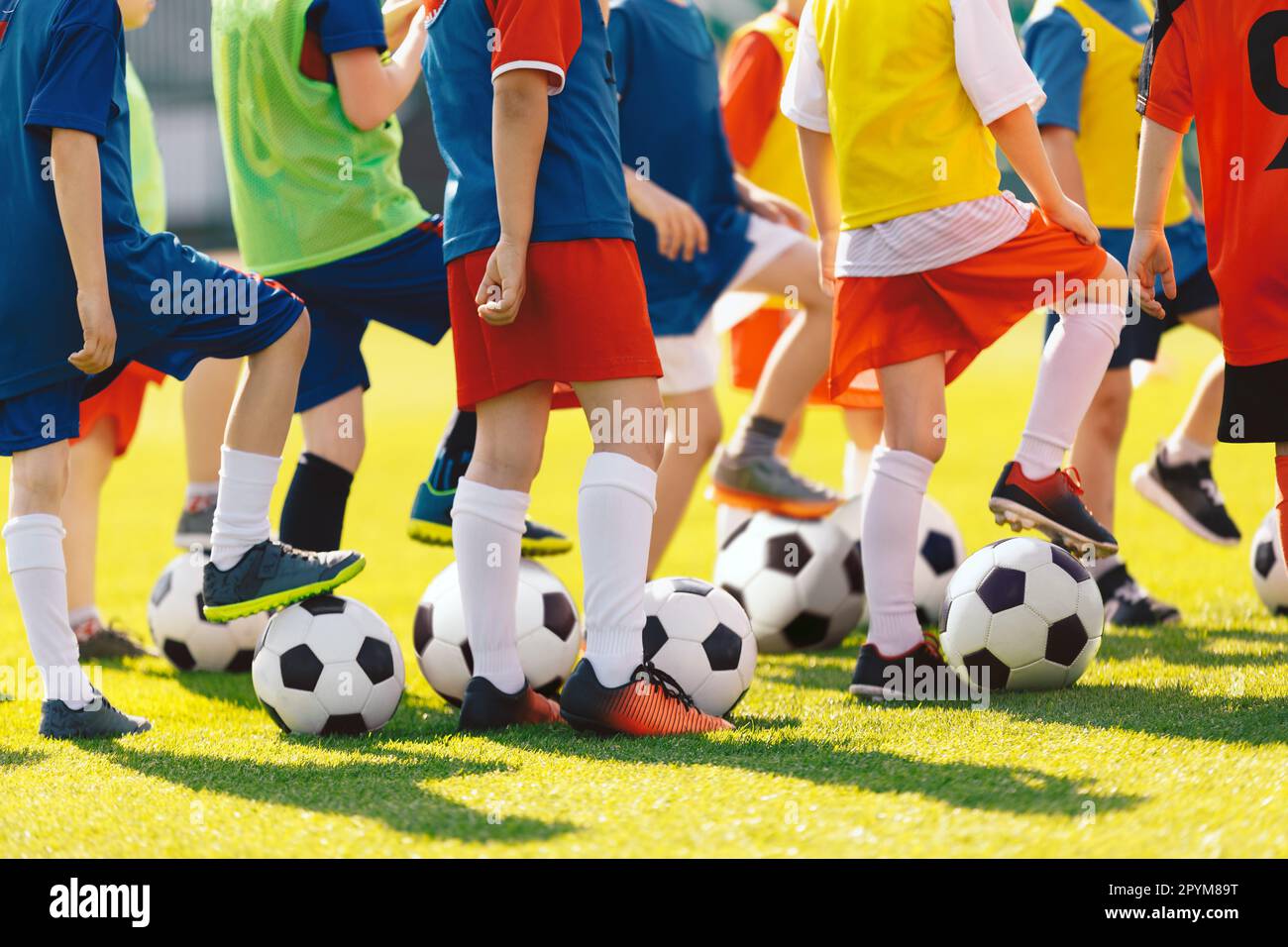 Soccer Training For Little School Children. Group of Kids With Football ...