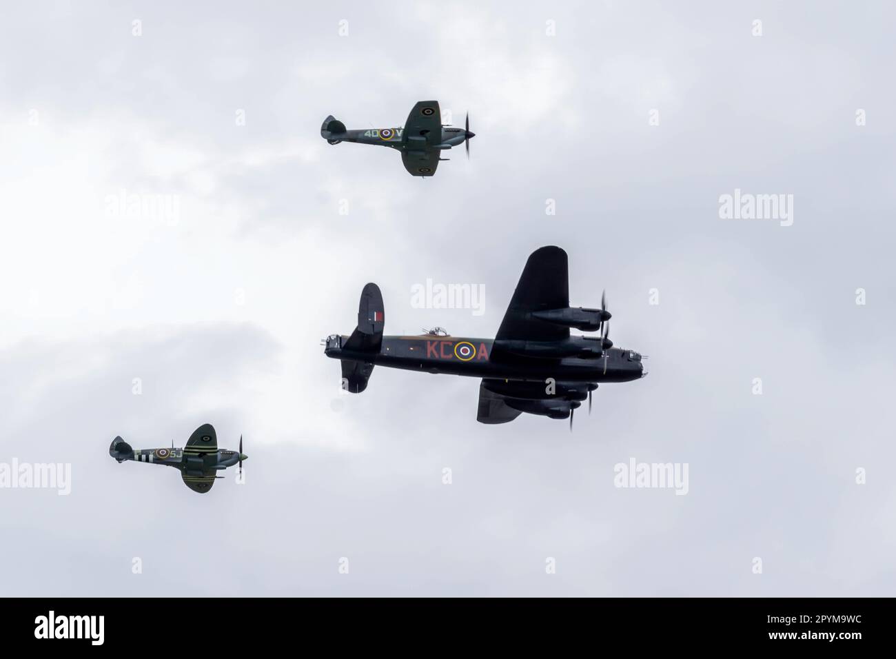 Avro Lancaster flanked by two Spitfires Stock Photo - Alamy