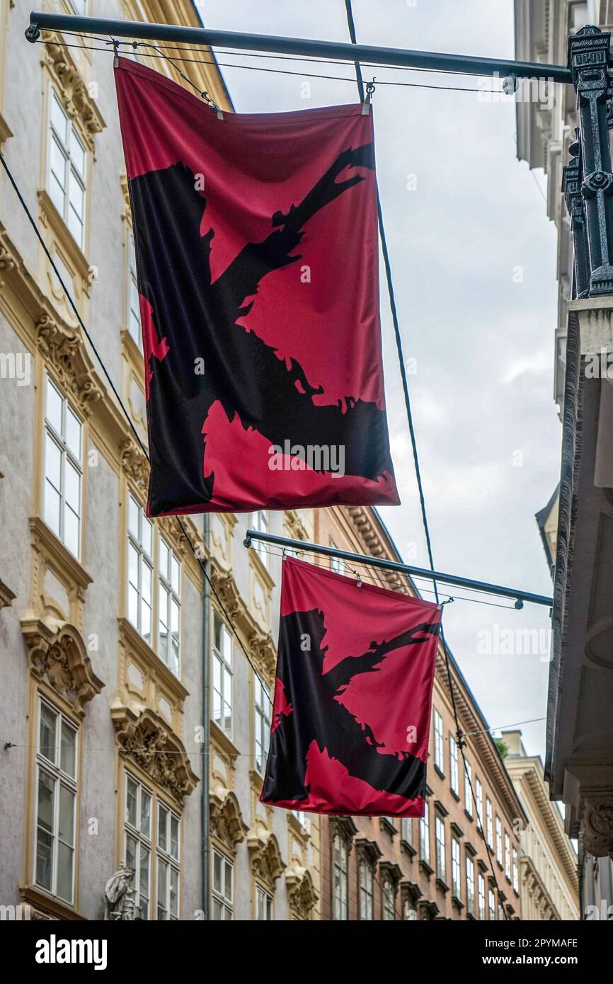 Unusual flags hanging from a building near the Hofburg in Vienna Stock ...