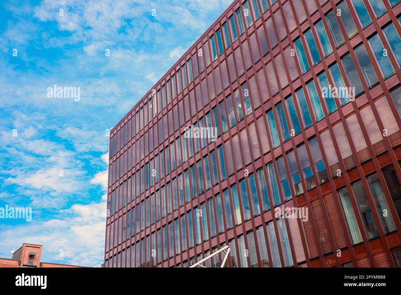 Modern red office building in Hamburg Stock Photo - Alamy