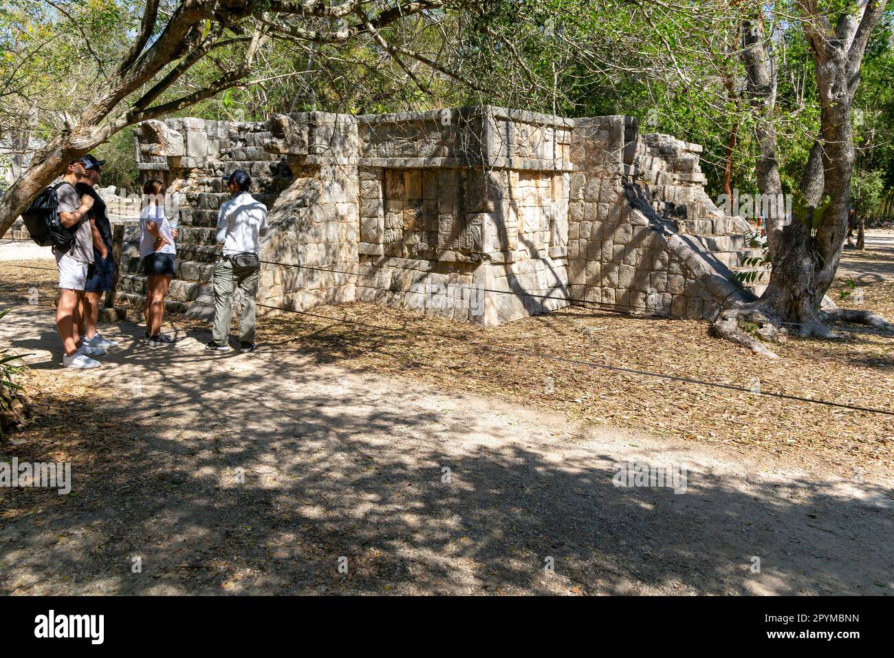 Tour guide and small group at one of the smaller buildings, Chichen ...