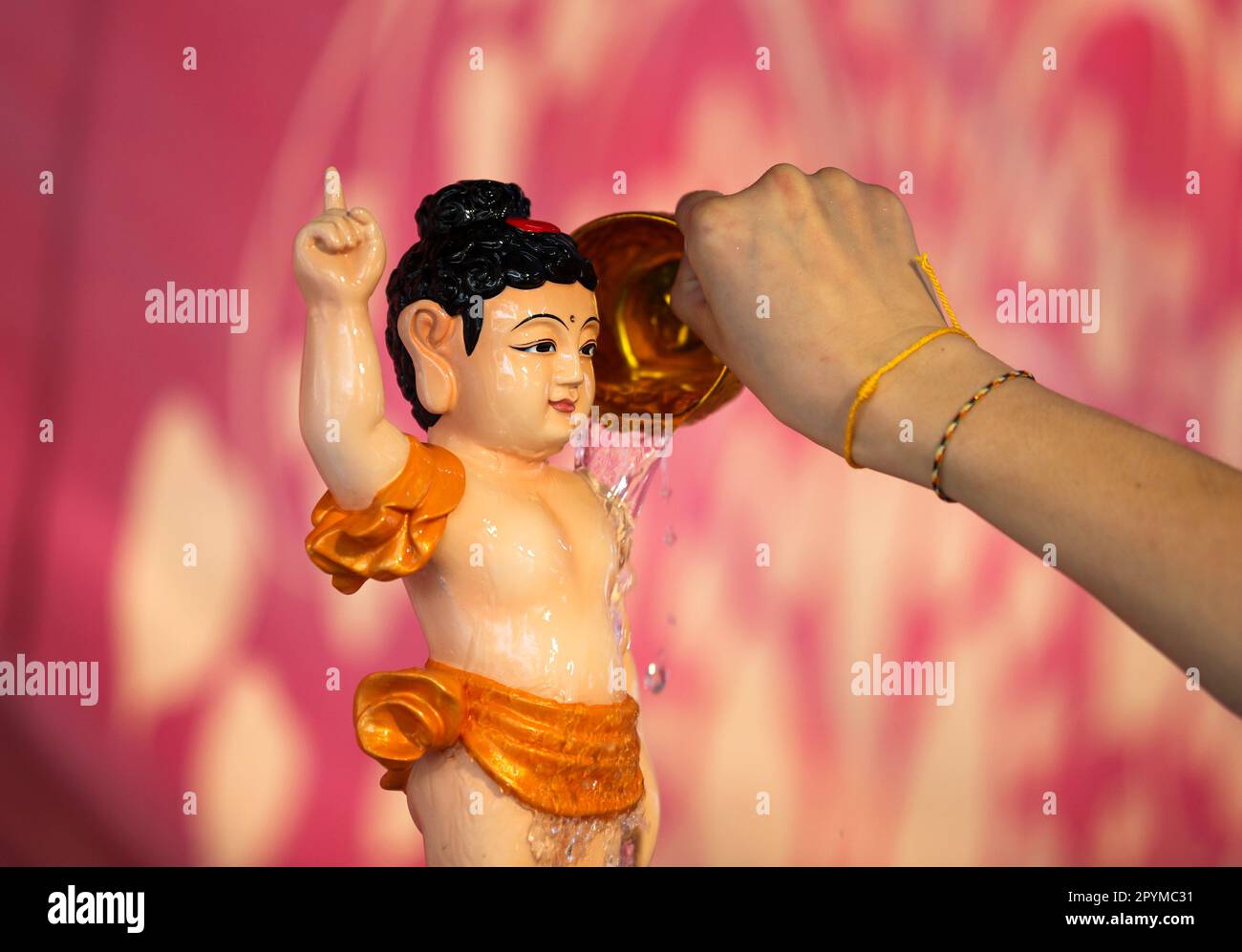 Buddhist devotees bathing buddha statue hi-res stock photography and ...