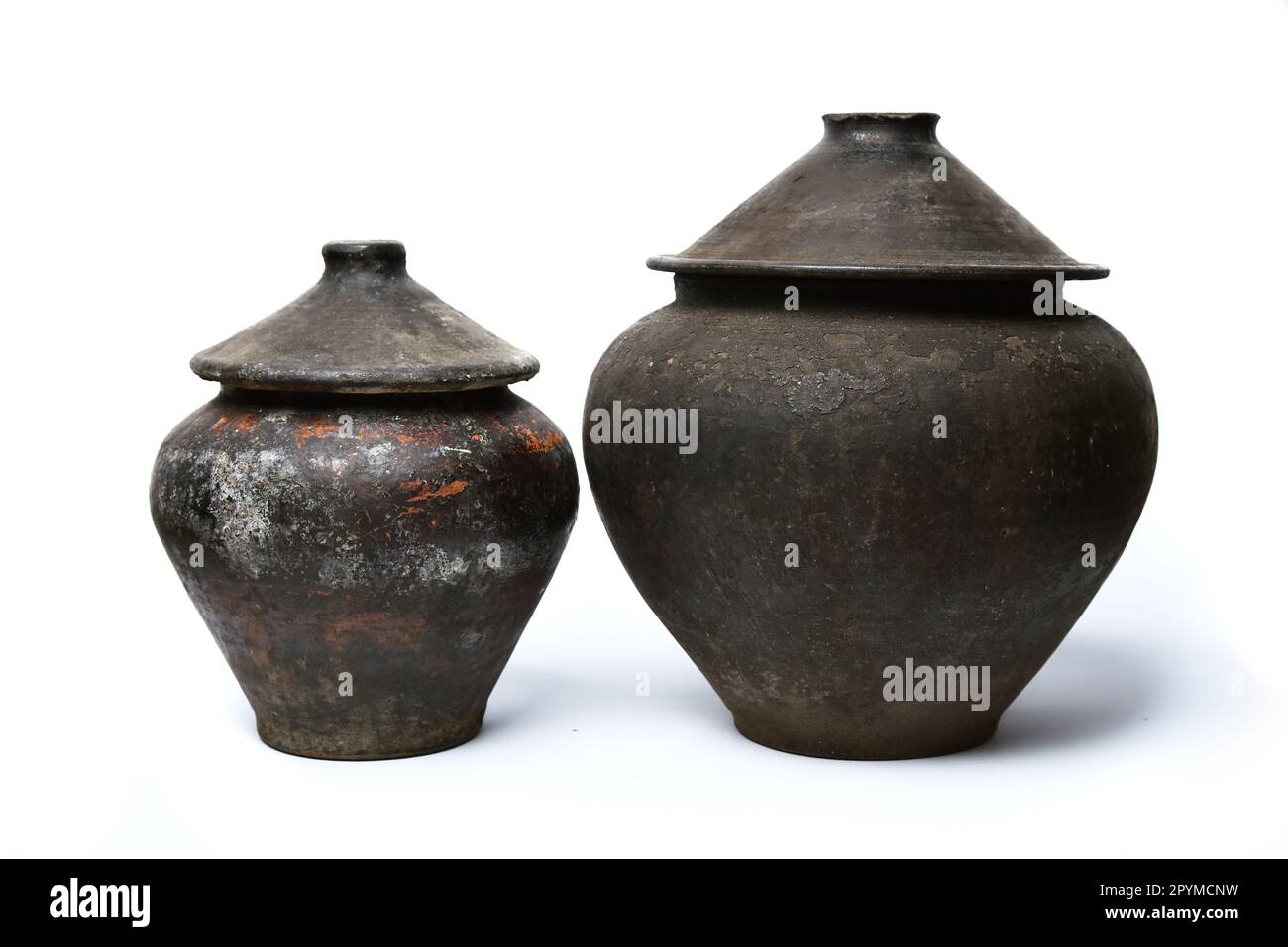 Two clay pots with lids. Traditional old Ukrainian kitchen utensils ...
