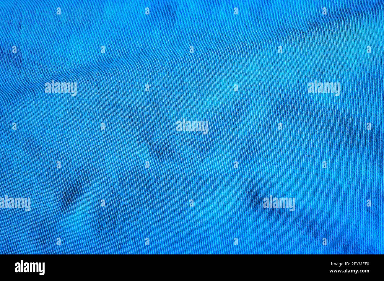 Blue wavy fabric texture. Close-up of cotton t-shirt, may be used as ...
