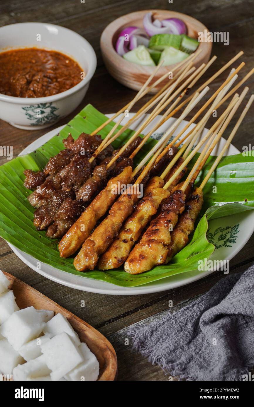 Grilled food chicken and beef satay eaten with peanut sauce is famous ...