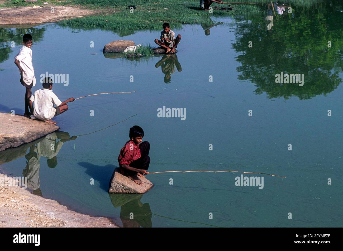 Boys fishing using angling, Tamil Nadu, South India, India, Asia Stock ...