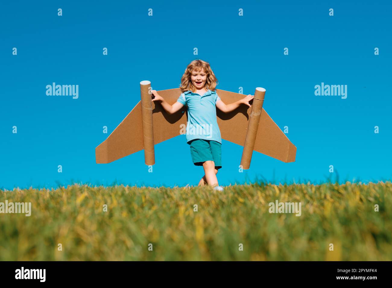 Dreams of travel. Child flying on jetpack with toy airplane on sky ...