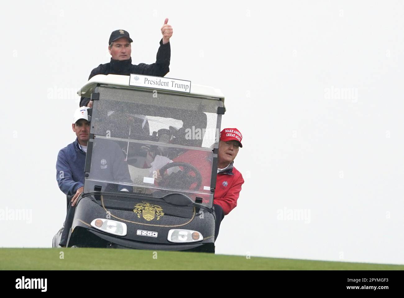 Former US president Donald Trump (right) playing golf at Trump ...