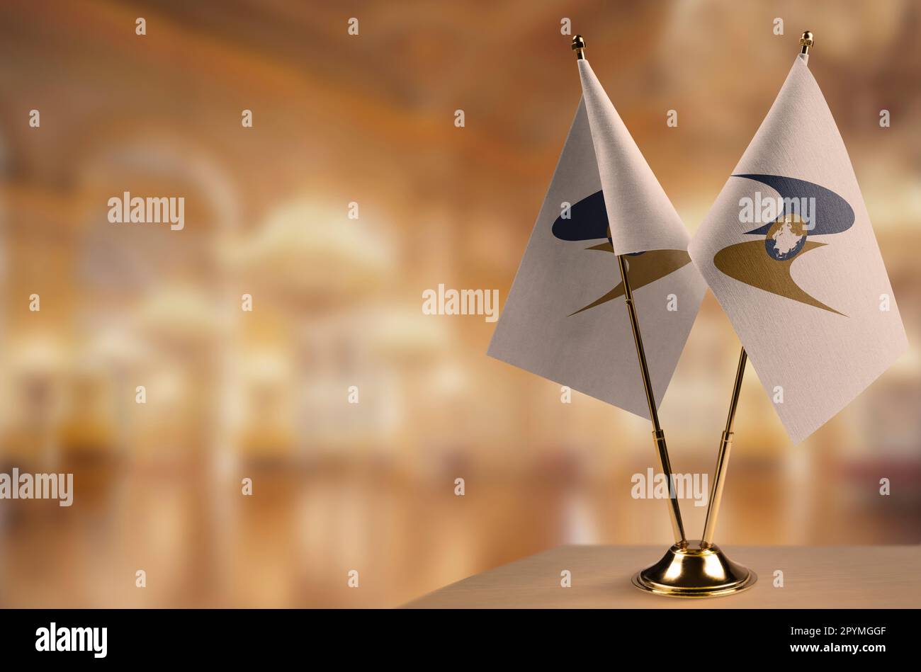 Small flags of the Eurasian Economic Union on an abstract blurry ...