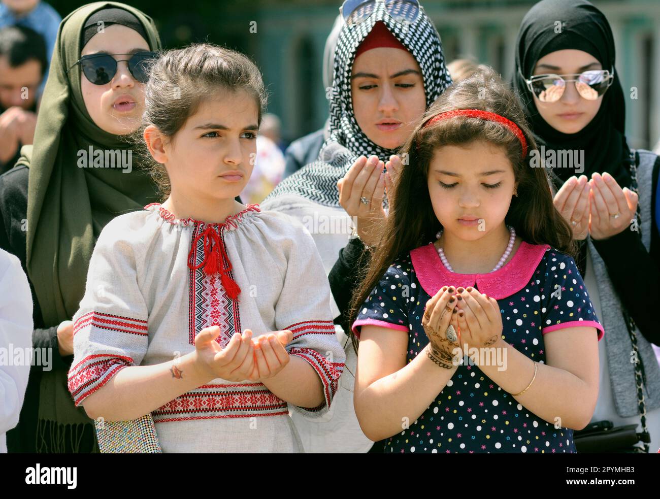 Crimean Tartar girls and Muslim young women praying on the street ...