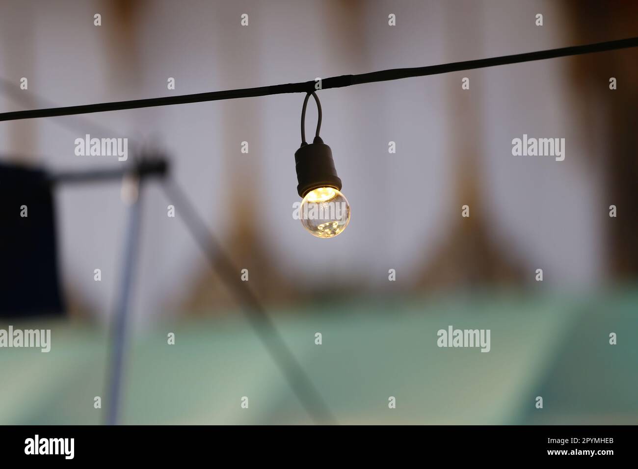 A light bulb hanging on the railing, Hanging bulb set with multiple ...