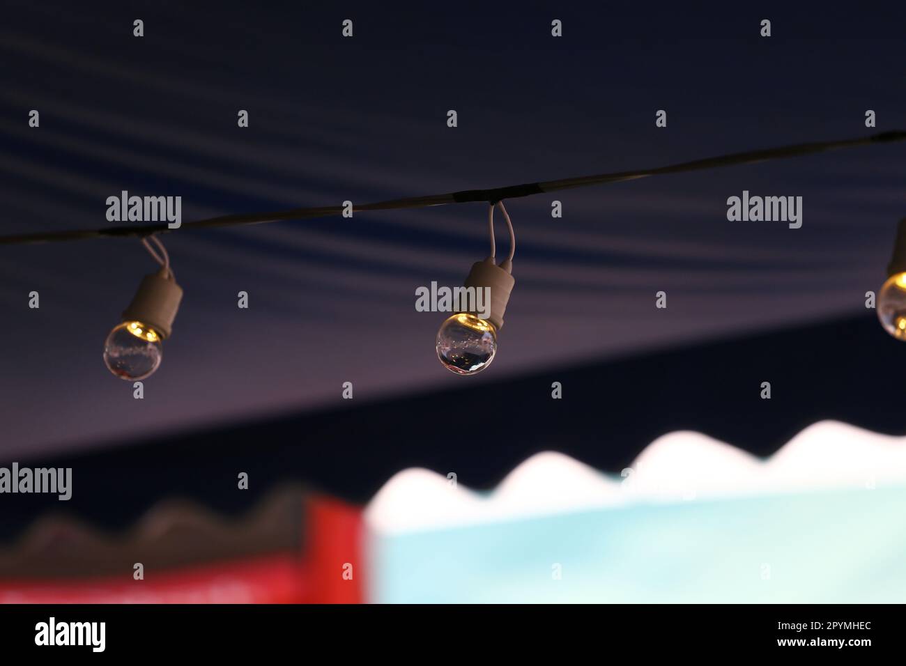 A light bulb hanging on the railing, Hanging bulb set with multiple ...