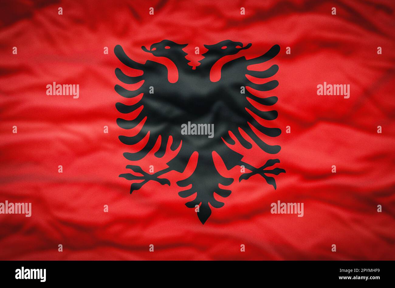 Albanian flag on a fabric wavy background. Wavy flag of Albania fills ...