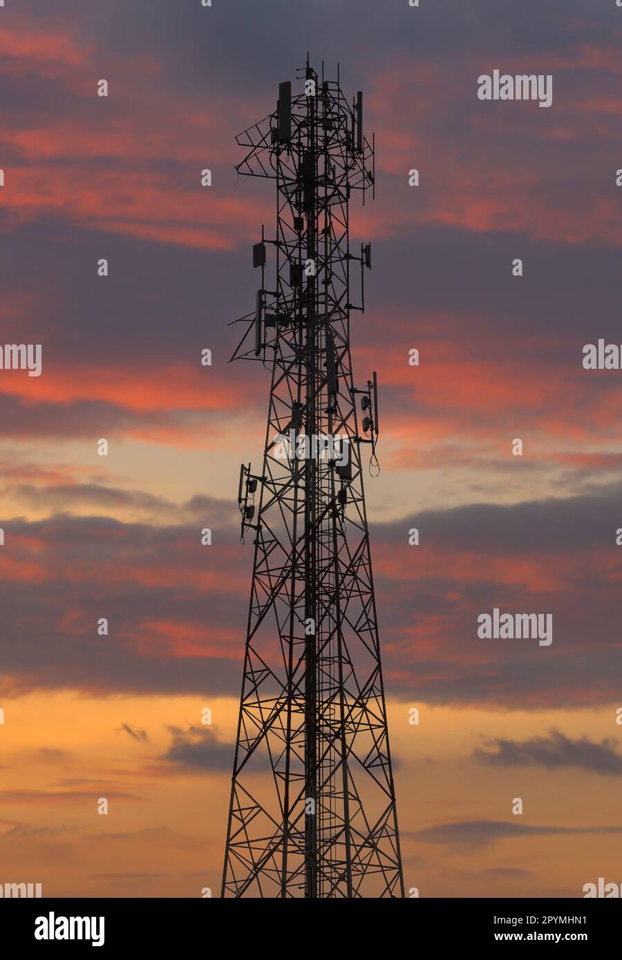Telephone tower on a twilight sky background, Antenna of internet system and mobile phone ...