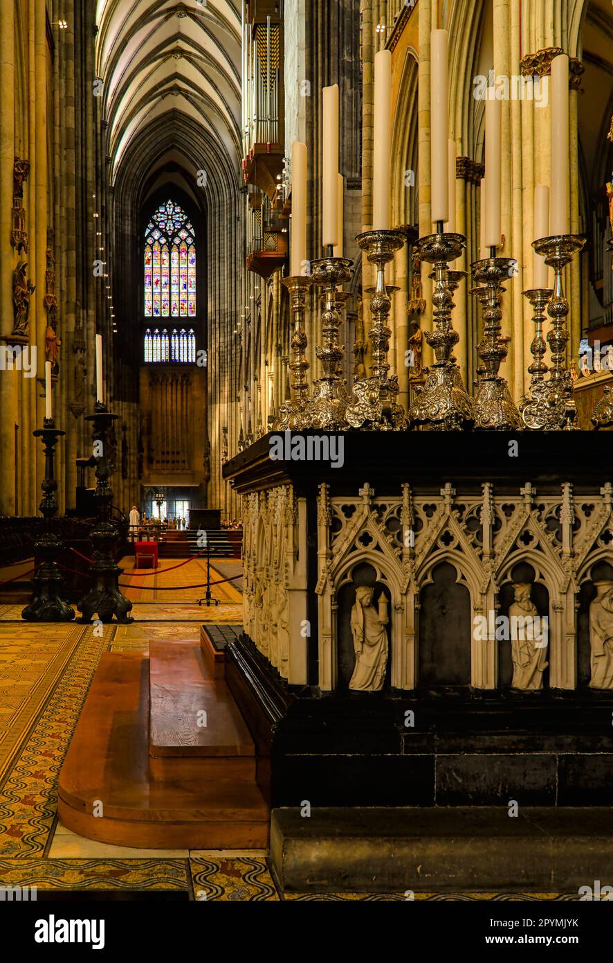 An interior shot of a church, with the altar at the center and stained ...